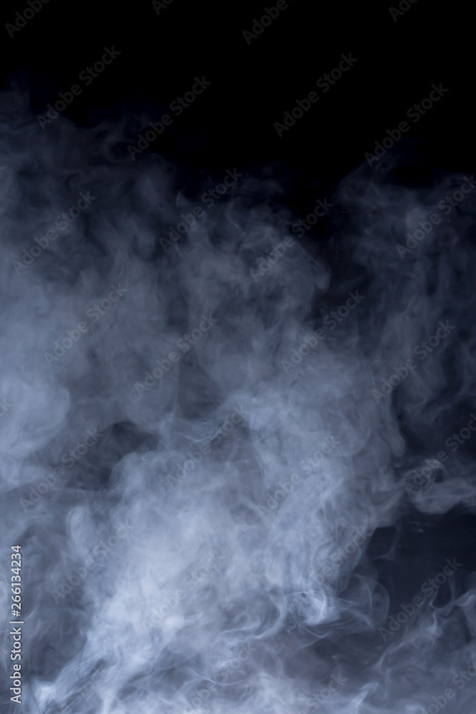 Smoke and fog in front of black background. Concept graphic elements ...