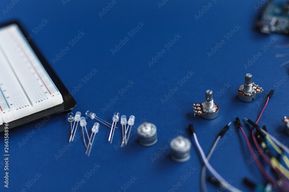 DIY electronic kit on the blue background, FLAT LAY, variety of sensor ...
