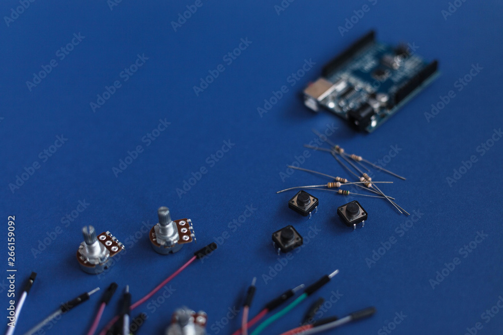 DIY electronic kit on the blue background, FLAT LAY, variety of sensor ...