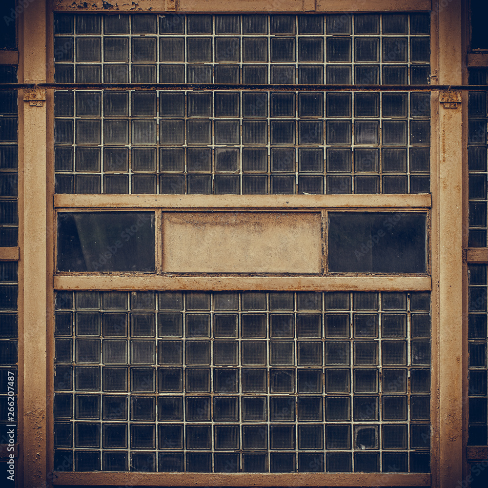 The wall of glass blocks. Pattern of square glass blocks. Industrial ...