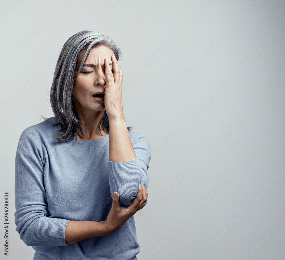 Asian woman in distress on white background Stock Photo | Adobe Stock