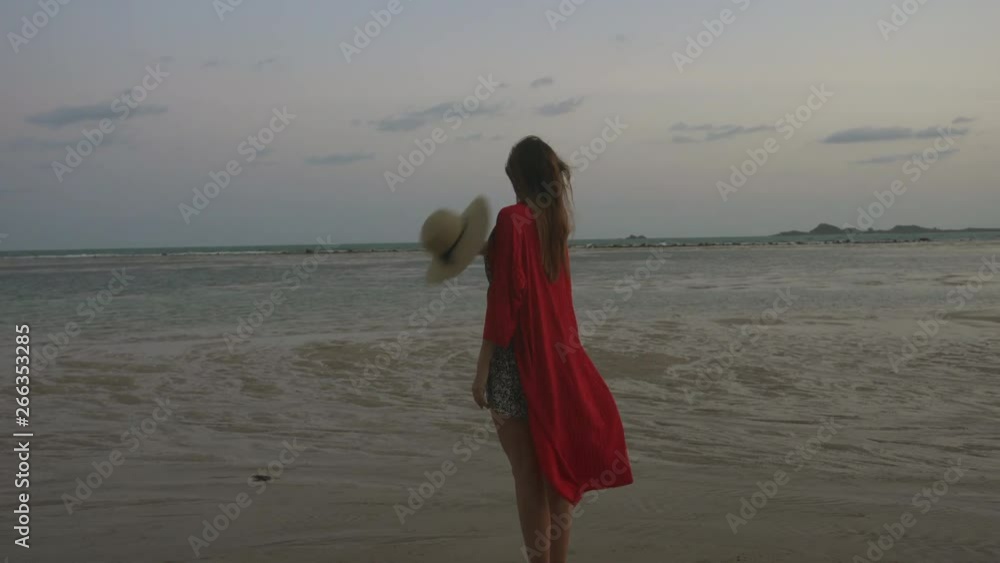 Beautiful girl walking on the beach in sunset golden hour. Young ...