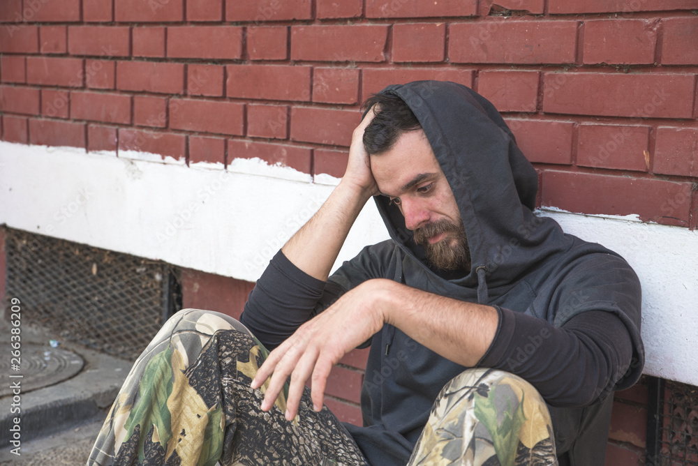 Homeless man, Homeless man drug and alcohol addict sitting alone and ...