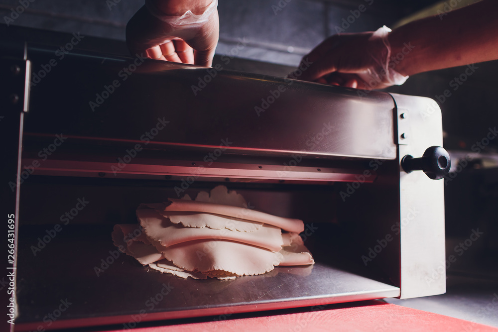 Chef making dough pastry sheeter bakery Baker forming shaping dough ...