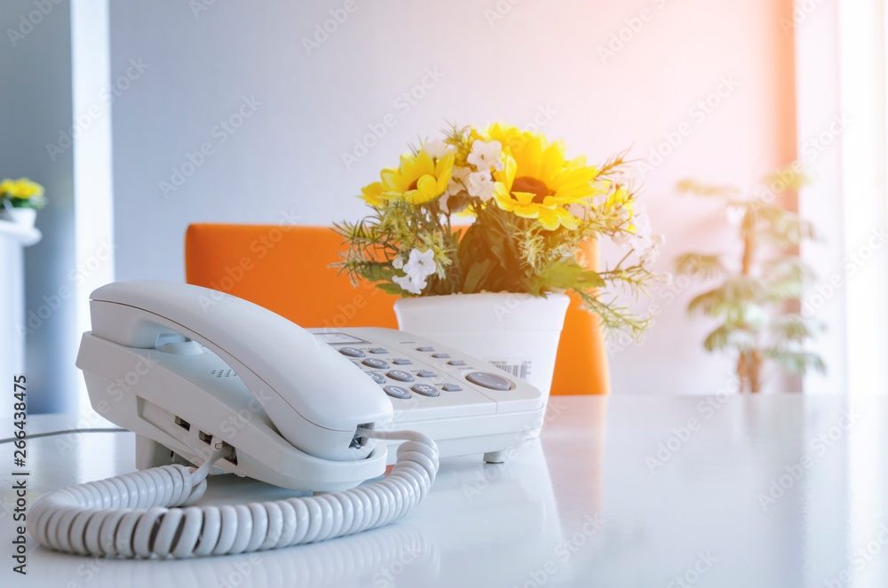 soft focus on telephone devices at office desk with light effect ...