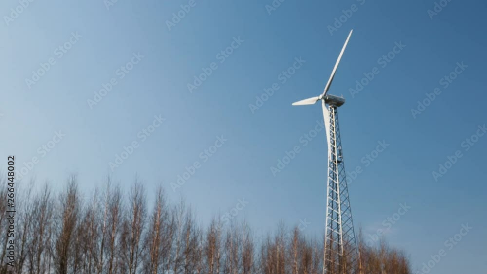 Stockvideon A powerful wind turbine with the rotation of the three ...