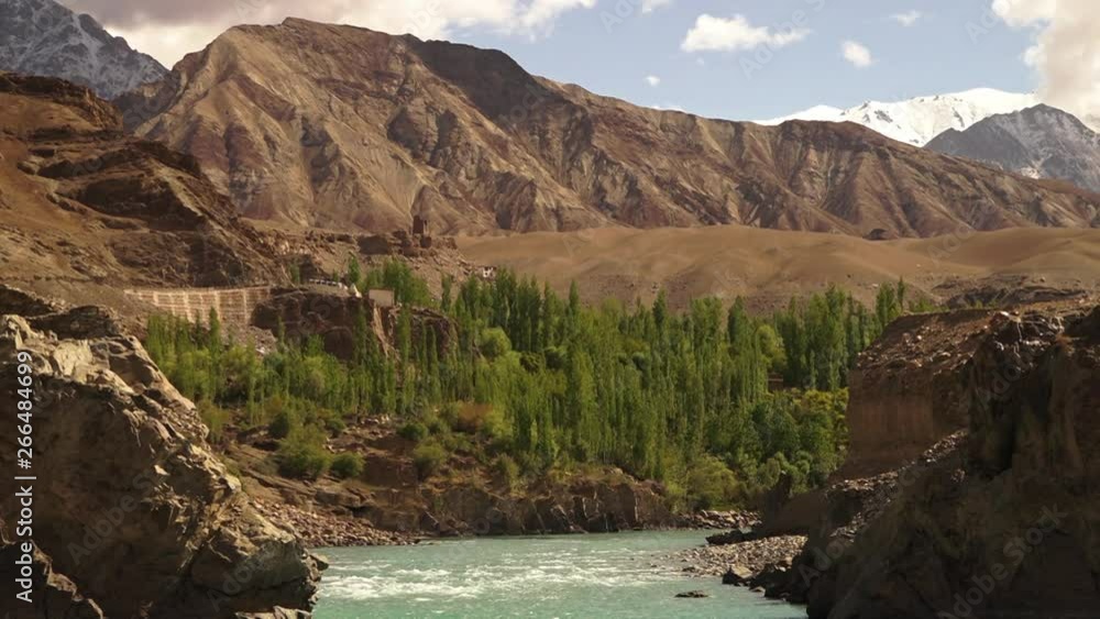 wide still, low-angle, spectacular shot of the source of Ganga river ...