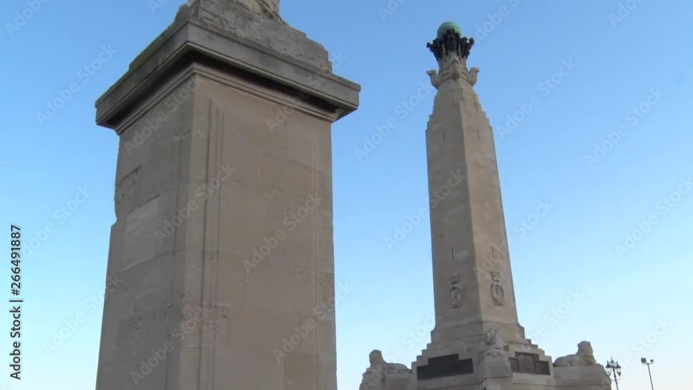Tilt up reveal of the Portsmouth Naval War Memorial plinth with unicorn ...