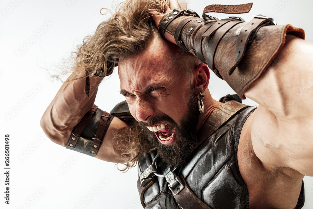 Strenght and energy. Blonde long hair and muscular male model in ...