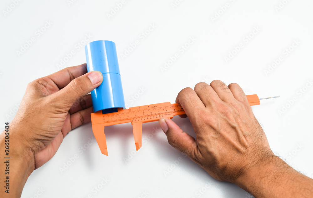 Measure an inner diameter of PVC pipe with vernier caliper Stock Photo ...