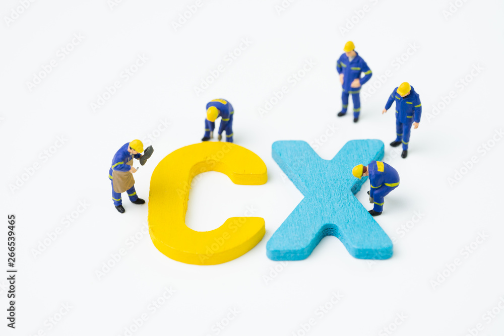 CX, Customer Experience concept, miniature figure worker building ...