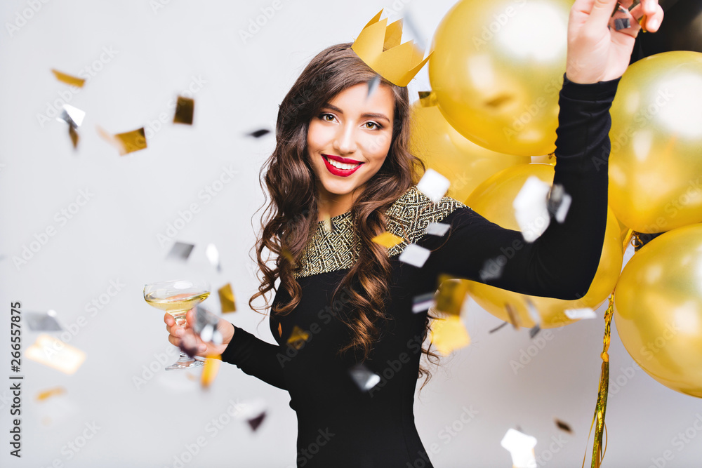 Crazy party time of beautiful women in elegant black dress and yellow ...