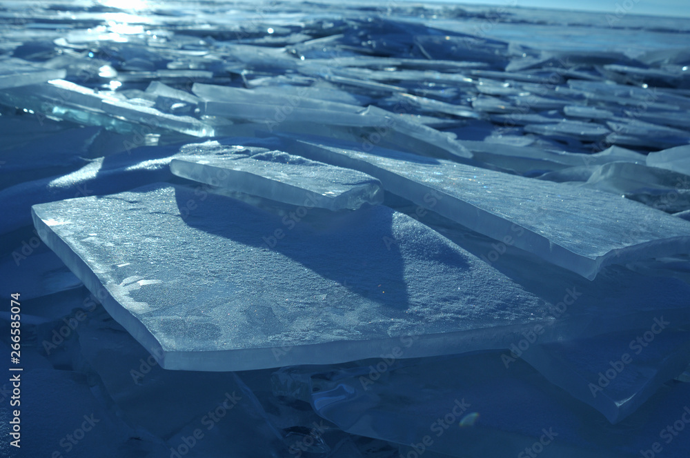 Sun rays are refracted by the transparent ice of Lake Baikal. crystal ...