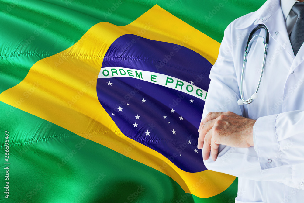Brazilian Doctor standing with stethoscope on Brazil flag background ...