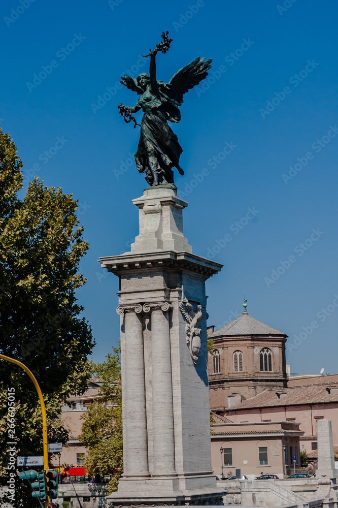 A bronze statue of winged Victory at the entrance to the Bridge of ...
