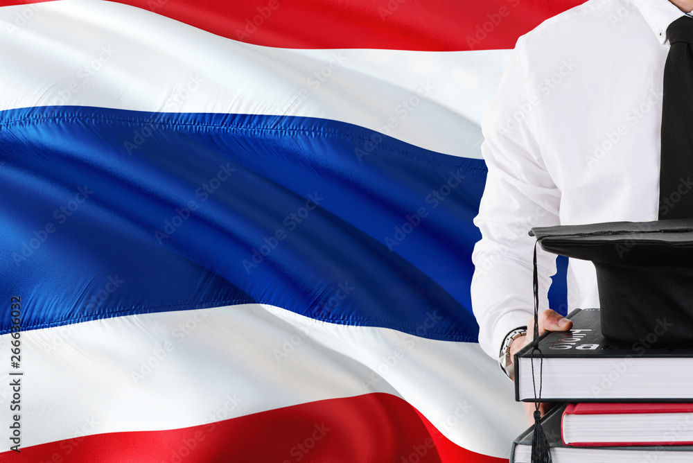 Successful Thai student education concept. Holding books and graduation ...