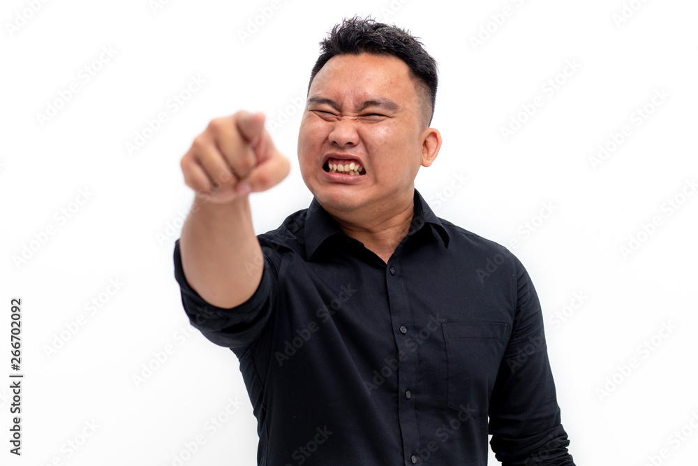 Angry asian man shouting and pointing finger isolated on white ...