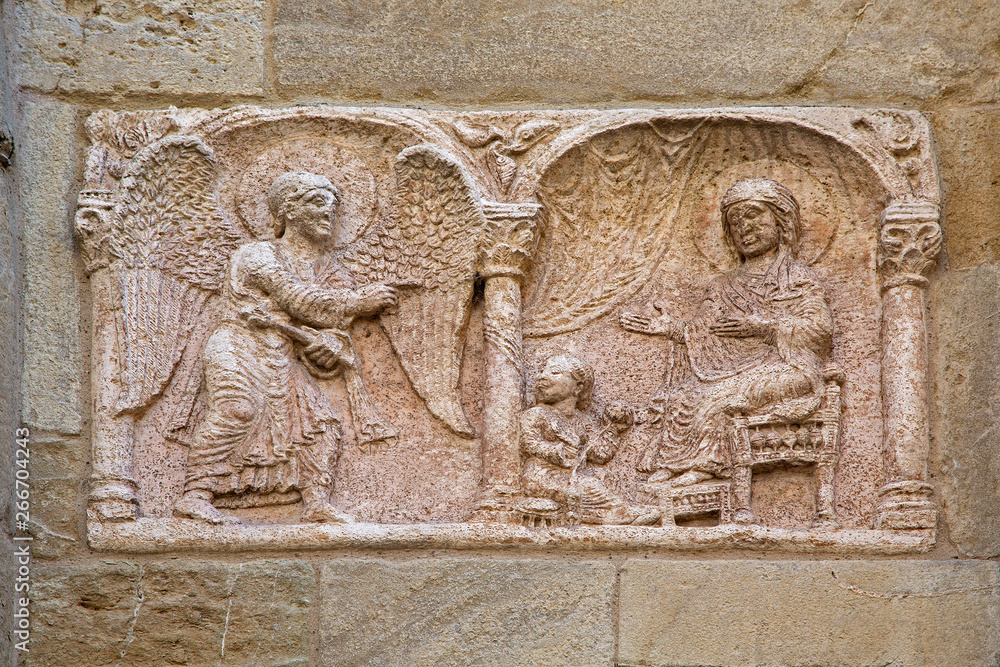 Italian medieval bas-relief representing the annunciation to Mary. The ...