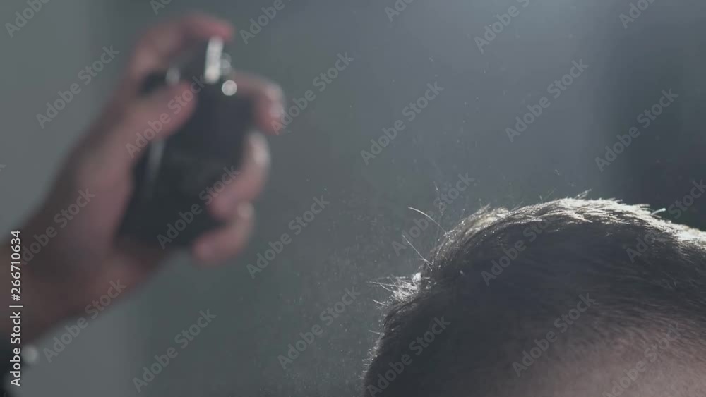 Vidéo Stock Barber combs his hair to a young guy with a beard and ...