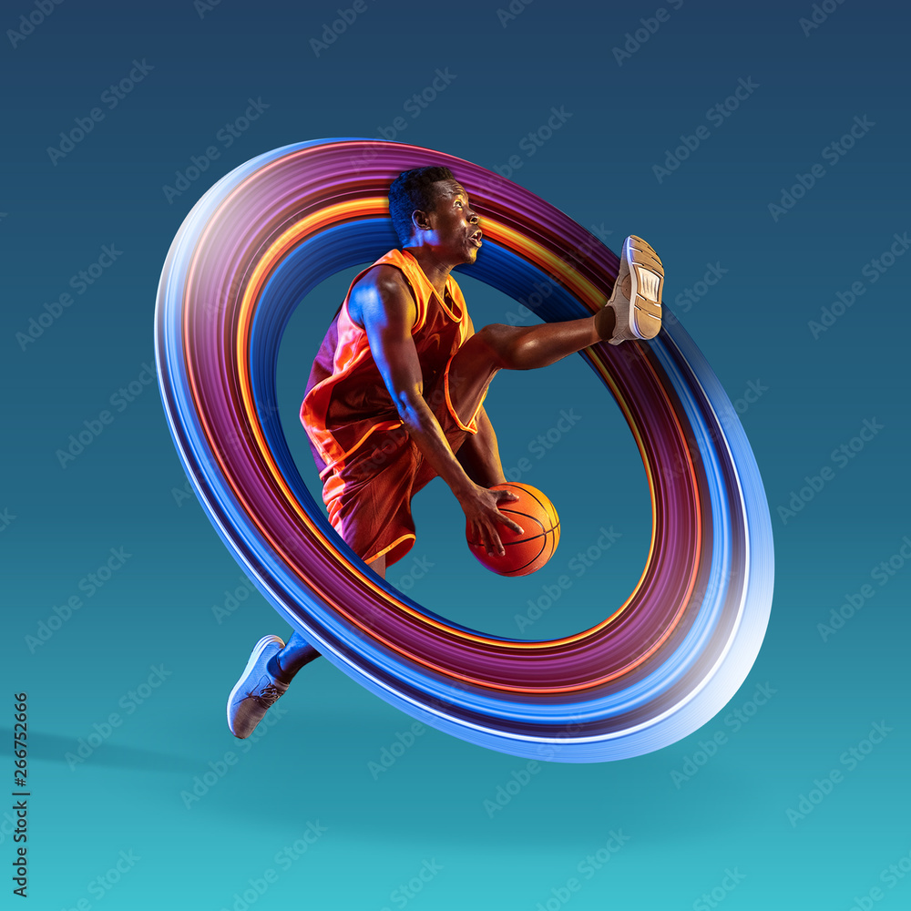 Full length portrait of a basketball player with a ball isolated on ...