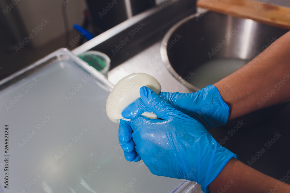 Production process of mozzarella cheese, cheese making process. Stock ...