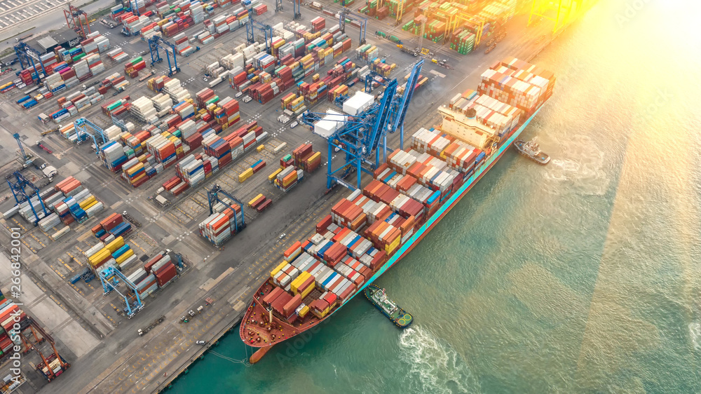 Container ship in export and import business logistics and ...