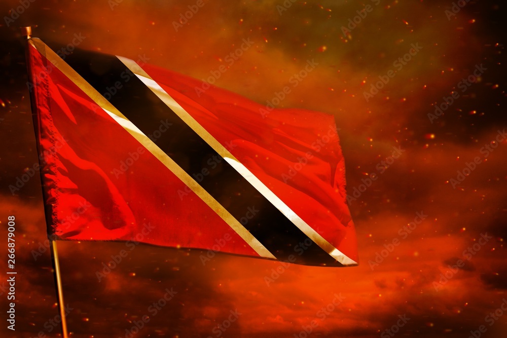 Fluttering Trinidad and Tobago flag on crimson red sky with smoke ...