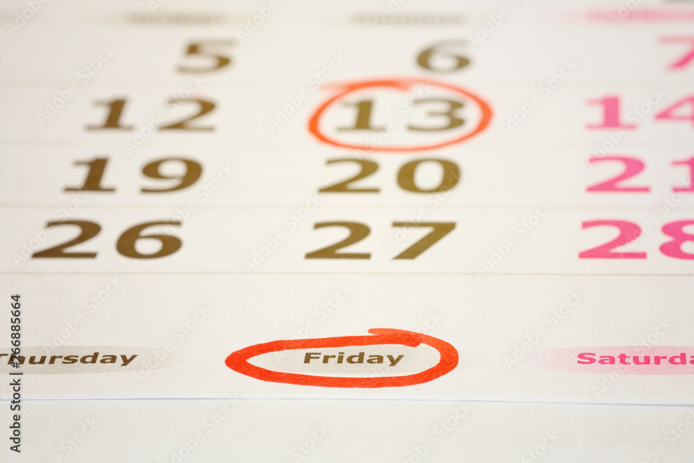red marked on a calendar concept for an important day. Friday the 13th ...