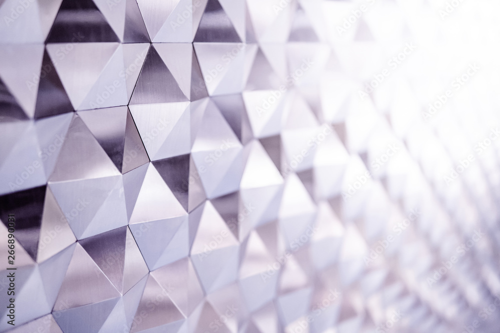 Close up detail of abstract modern metallic triangular wall pattern ...