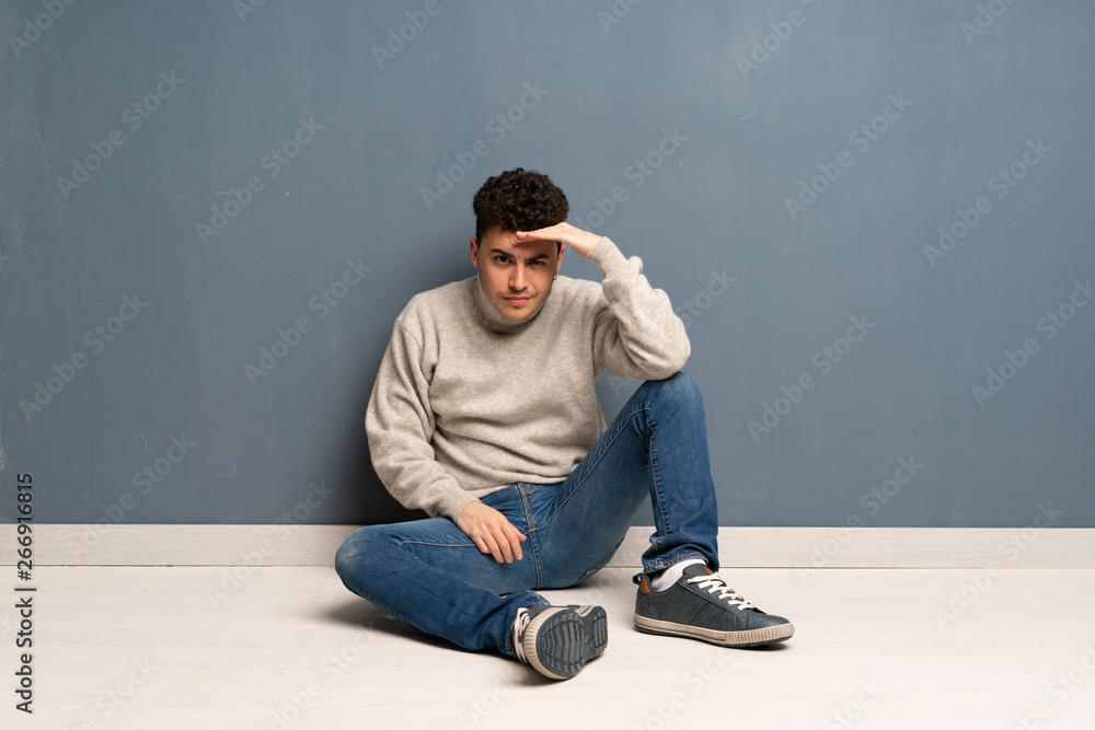 Person Sitting On Ground Facing Away