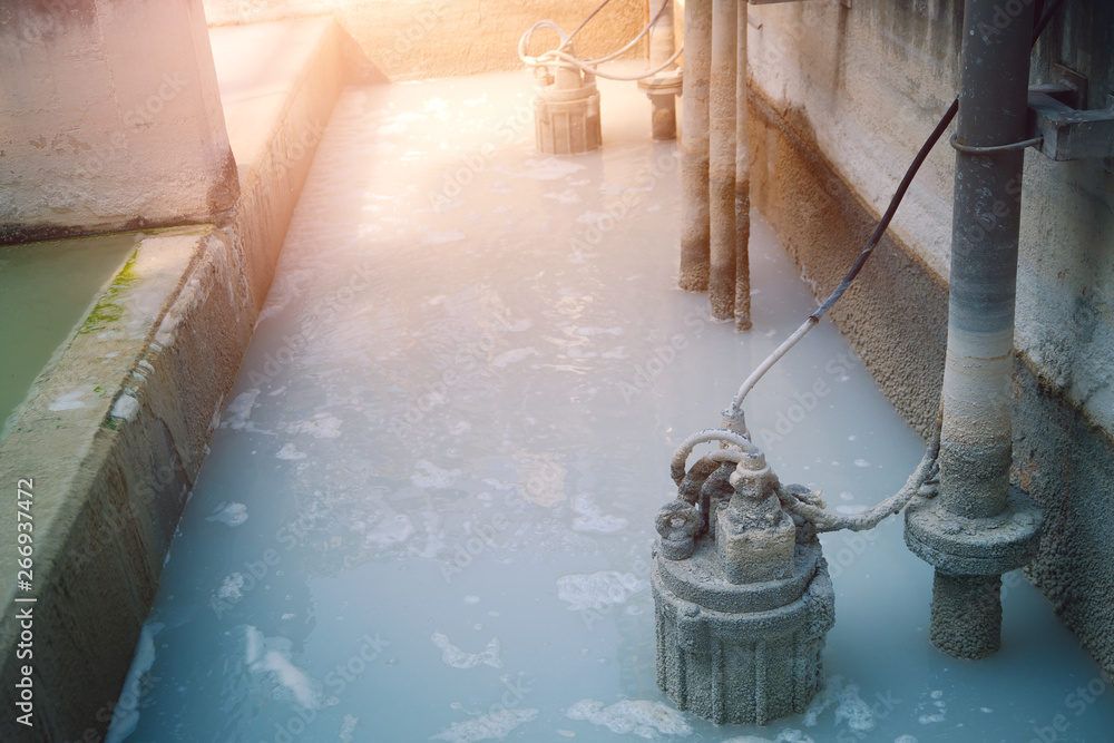 Waste water treatment pit with submersible pump Stock Photo | Adobe Stock