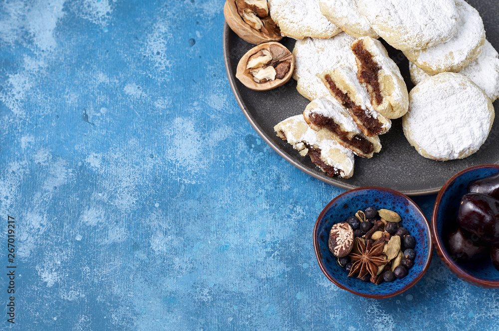 Arabic homemade cookies filled with dates and walnuts covered powdered ...