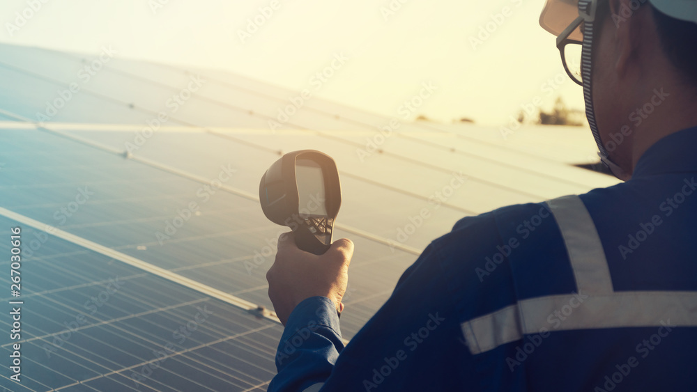engineer using thermal imager to check temperature heat of solar panel ...