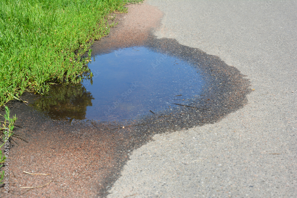 Puddle photo. Pot hole or pothole image of a broken cracked asphalt ...