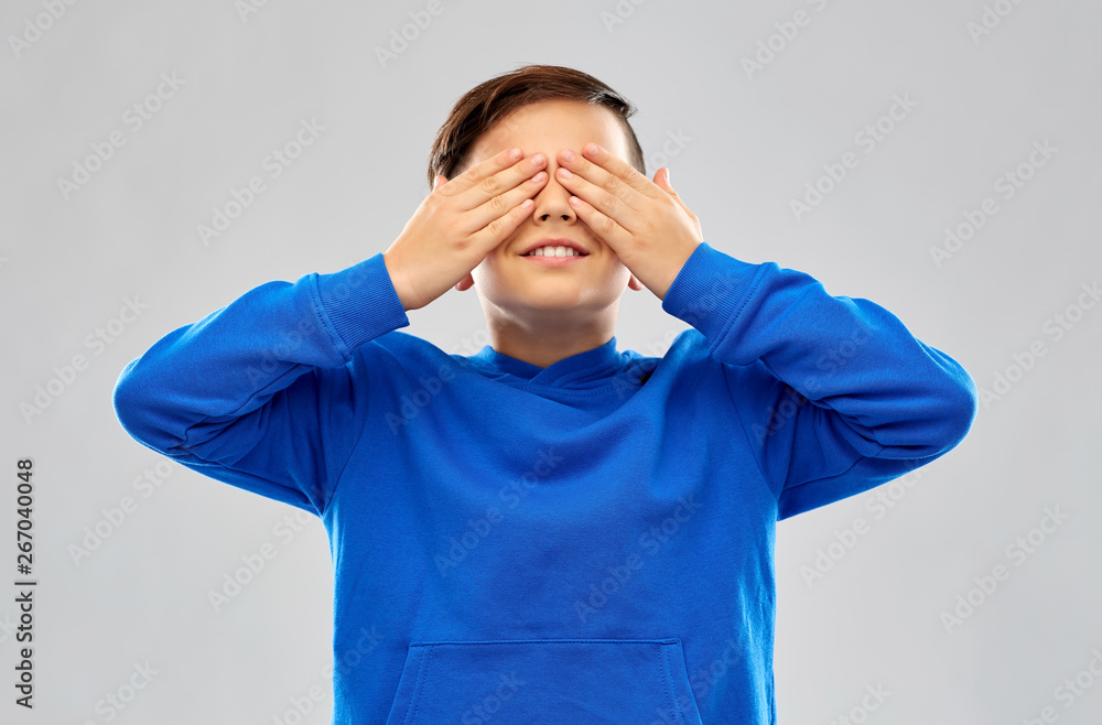 childhood, vision and seeing concept - little boy in blue hoodie ...