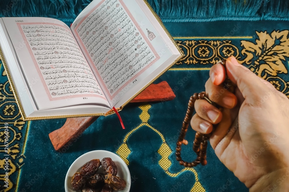 An islamic concept for Ramadhan. Flat lay composition of Qoran, Dates ...
