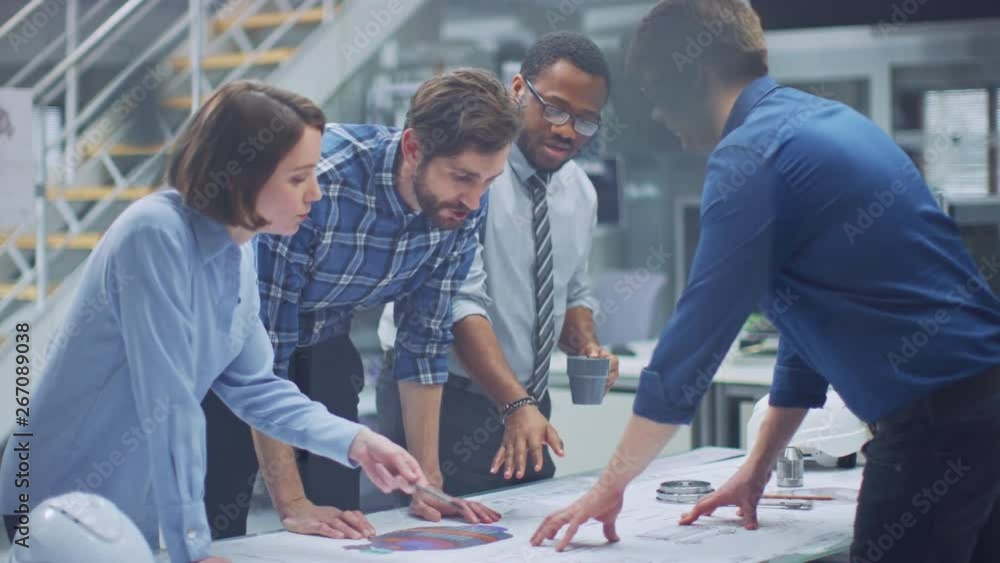 In the Industrial Engineering Facility: Diverse Group of Engineers ...