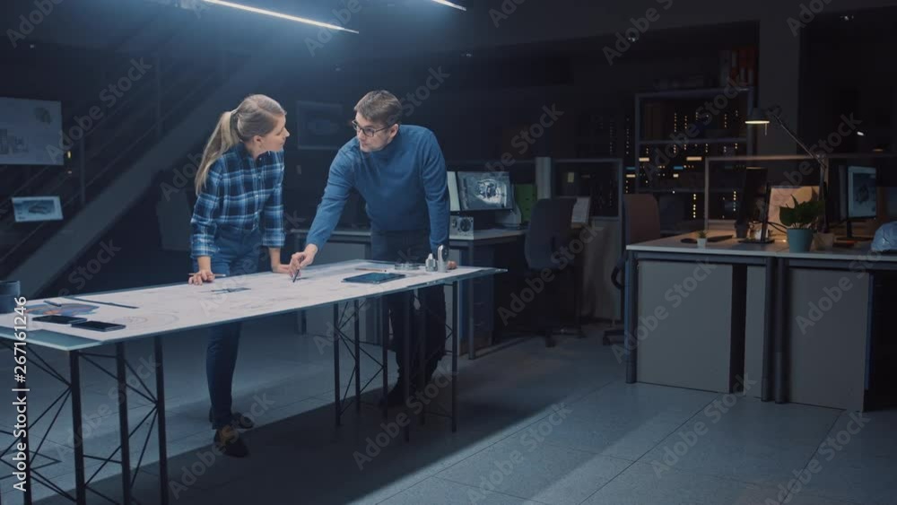 In Design Engineering Facility Male and Female Engineers Work on a ...