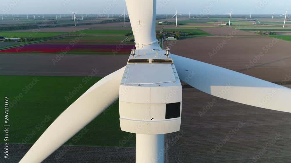 Aerial close up footage of wind turbine nacelle which is the housing on ...