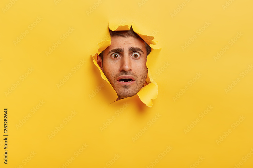 Human facial expressions concept. Worried young man with dark eyes ...