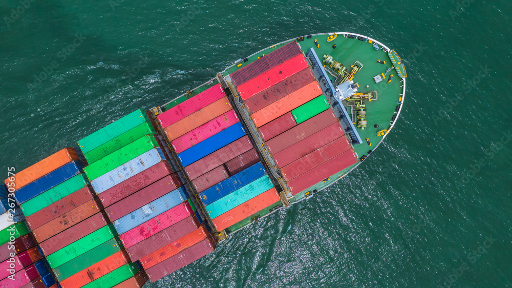 Container ship loading and unloading in deep sea port, Aerial top view ...