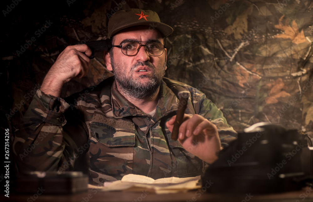 The evil dictator sitting on table. Angry communist general sitting at ...