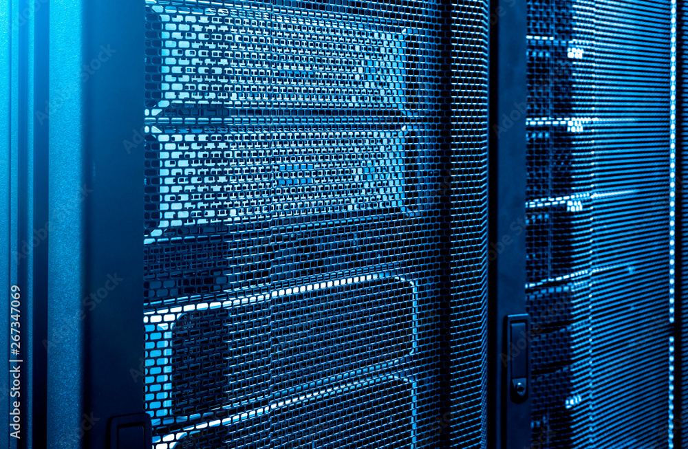 Close up server racks in modern data center neon blue tone background ...