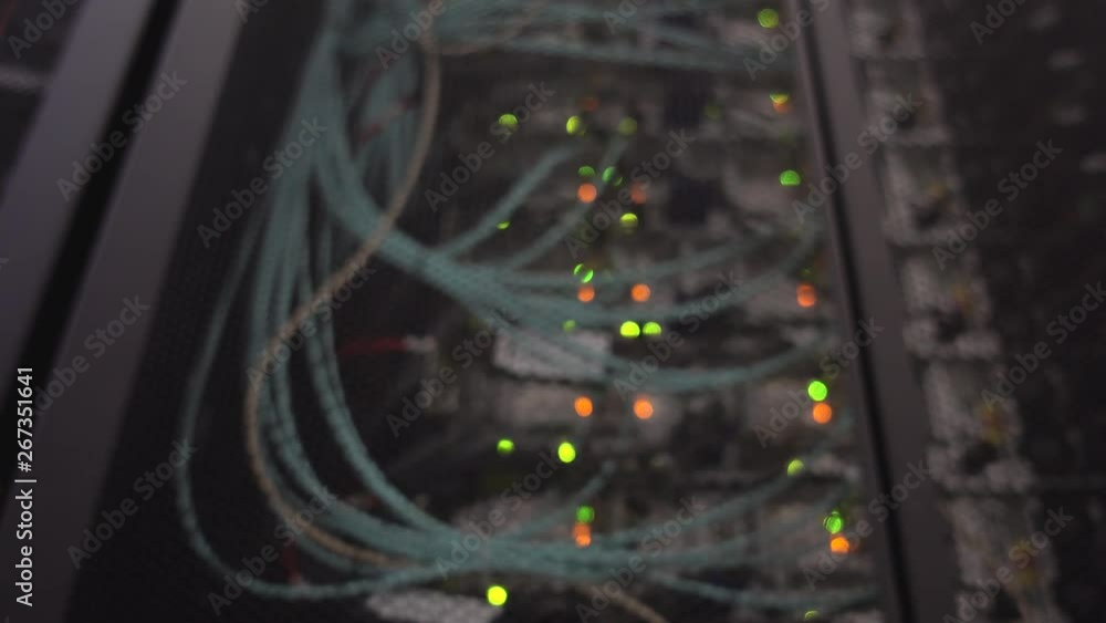 Data center, server room in a blurry background. Blinking blue and ...