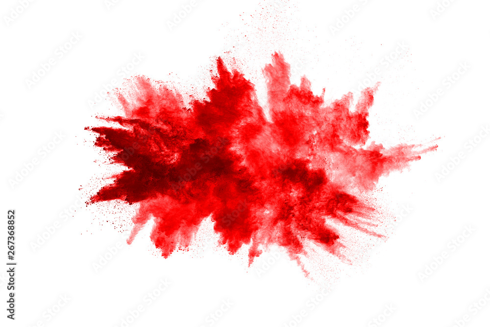 Freeze motion of red powder exploding, isolated on white background ...
