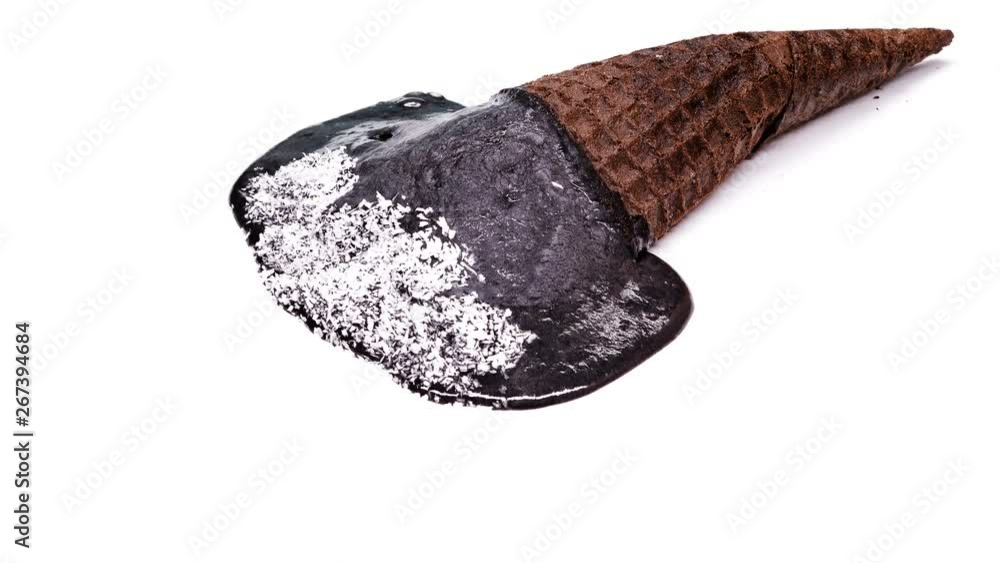 side view chocolate flavor ice cream cone with shredded coconut melting ...