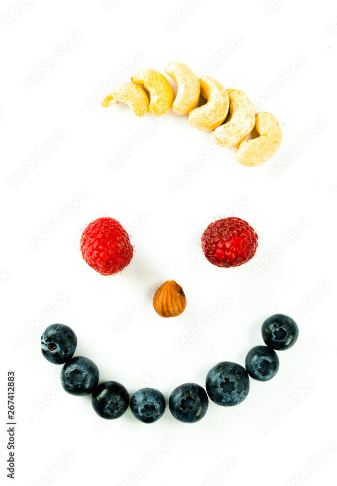 smiley face with berries and nuts and wild hair on a white background ...