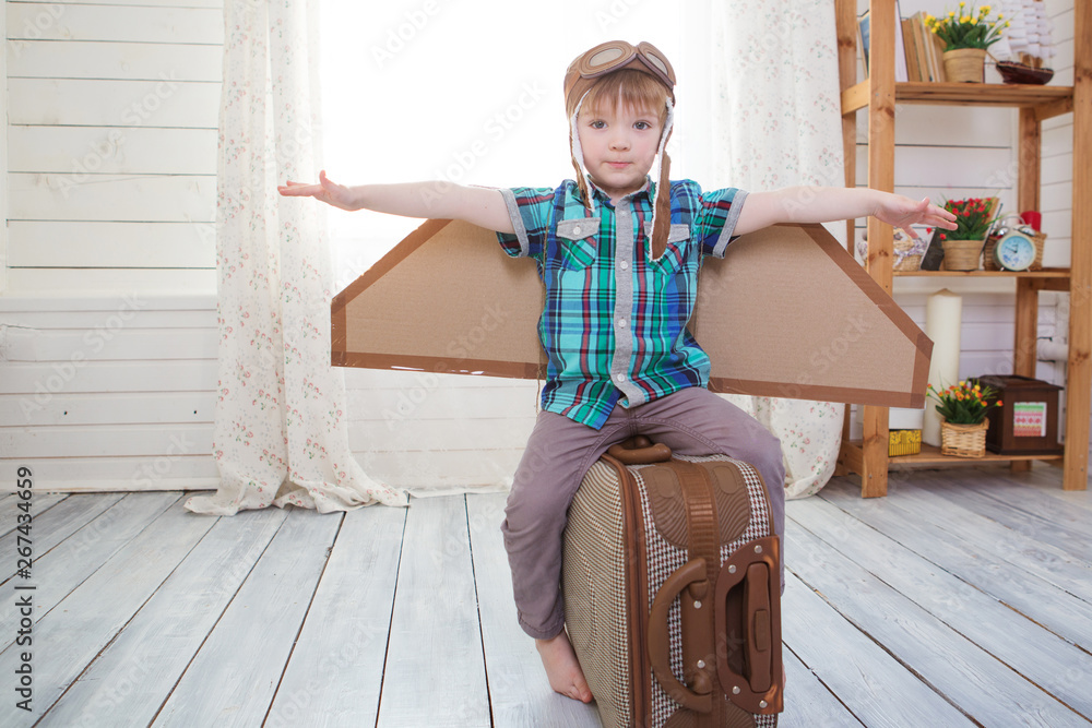 Children boy wearing pilot costume making ready to fly gesture standing ...