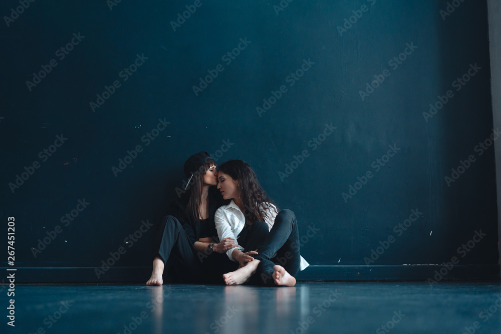 beautiful girls sit by the wall and pose Stock Photo | Adobe Stock