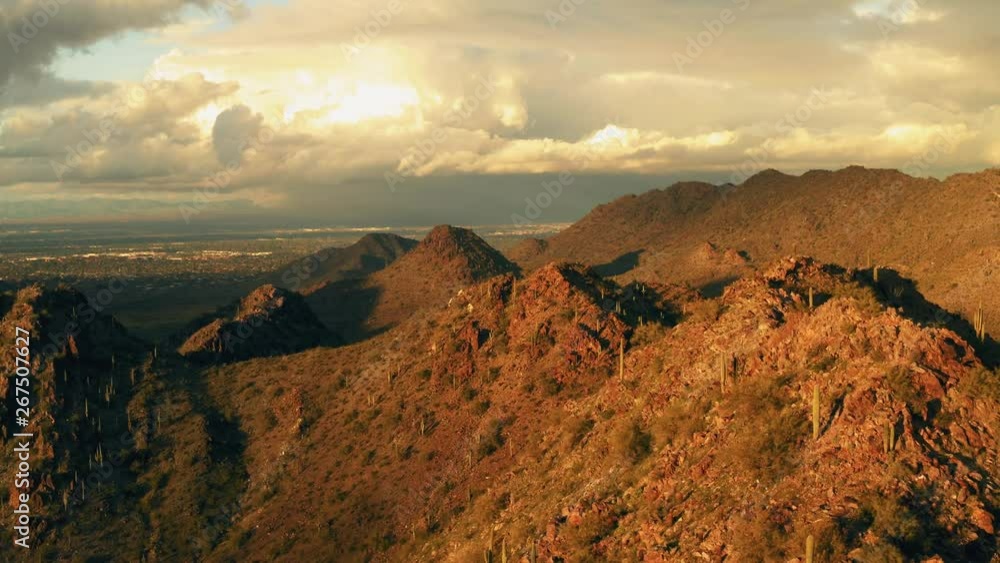 The aerial camera flies over the gorgeous rocky peaks of the Phoenix ...